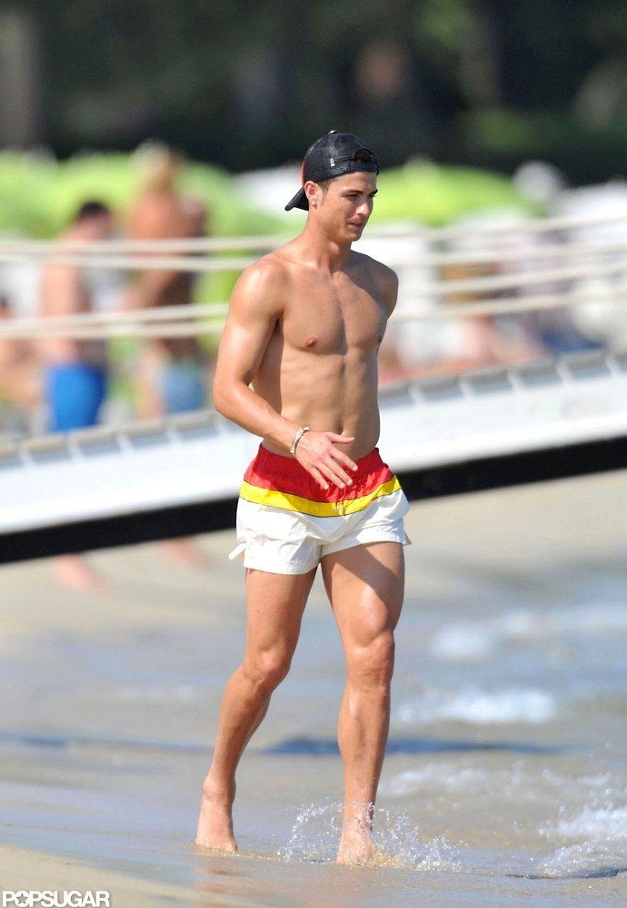 Cristiano Ronaldo Sported Short Swim Trunks And A Baseball Cap While